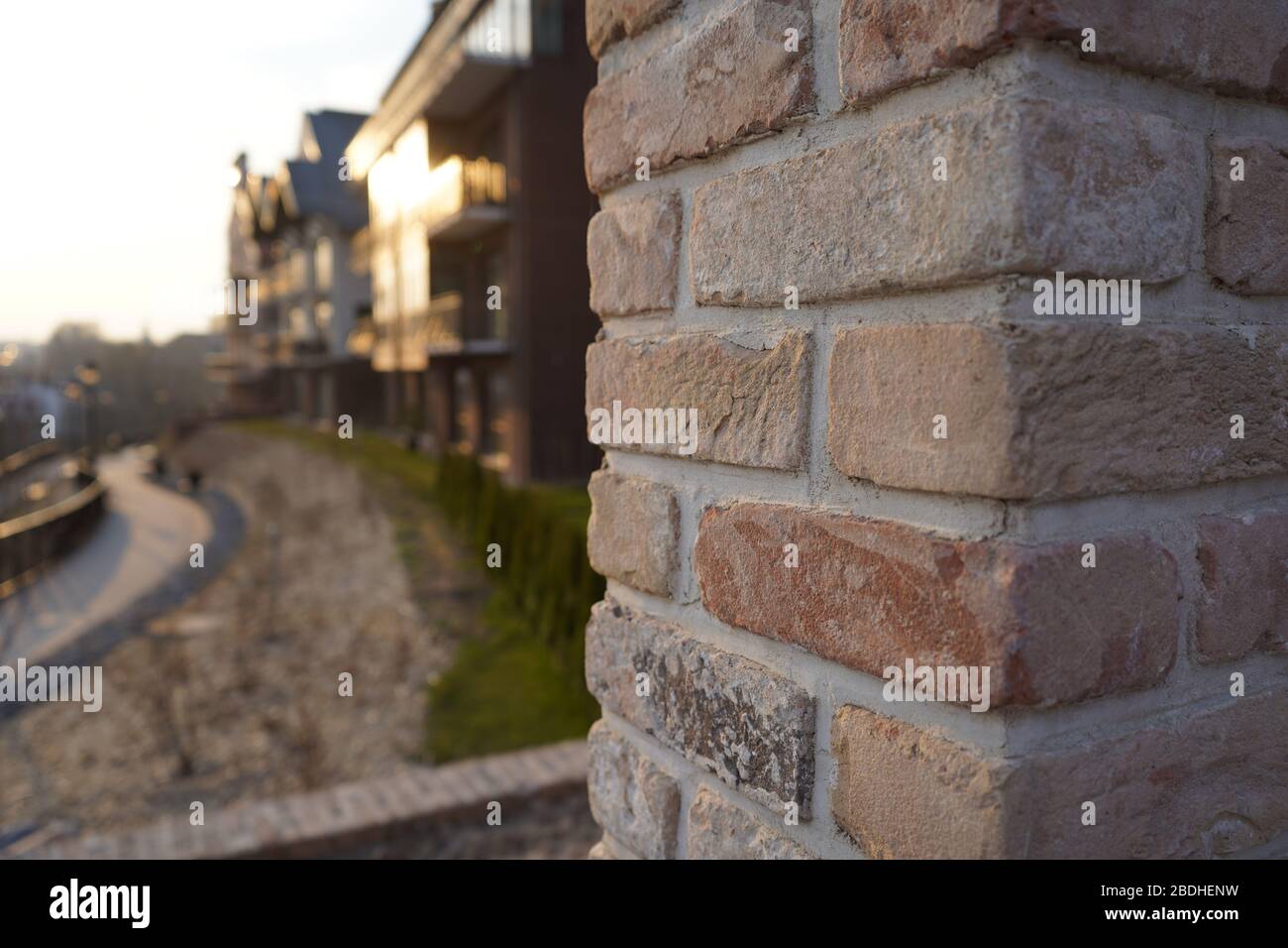Old brick wall and modern architecture buildings in the background ...