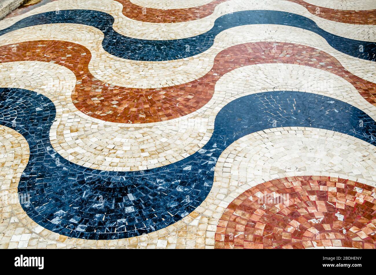 Colorful cobblestone pavement in Alicante, Spain, textured background ...