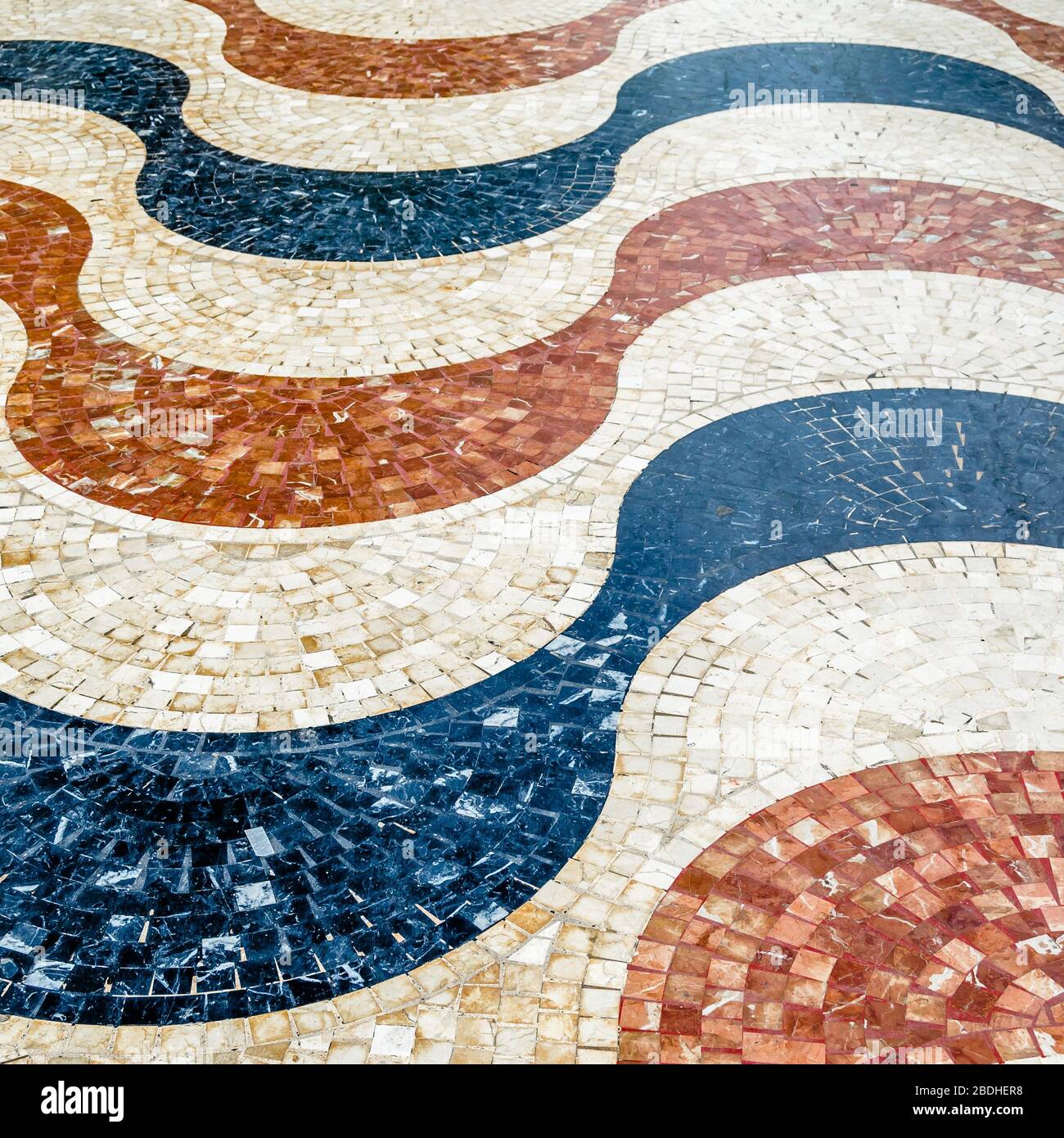 Colorful cobblestone pavement in Alicante, Spain, textured background ...