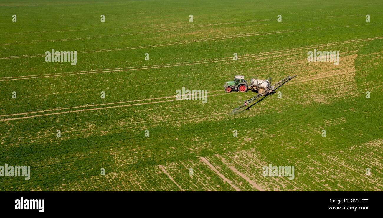Agriculture Tractor Working in Field Stock Photo - Alamy