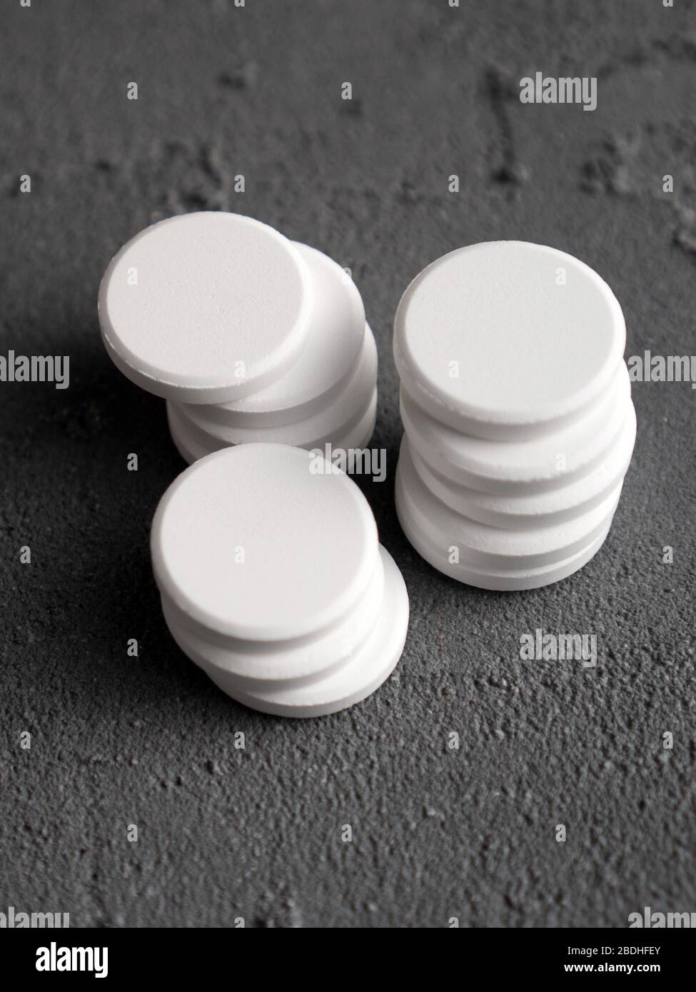 Stack of big white medicines on dark background. Pills stack Stock ...