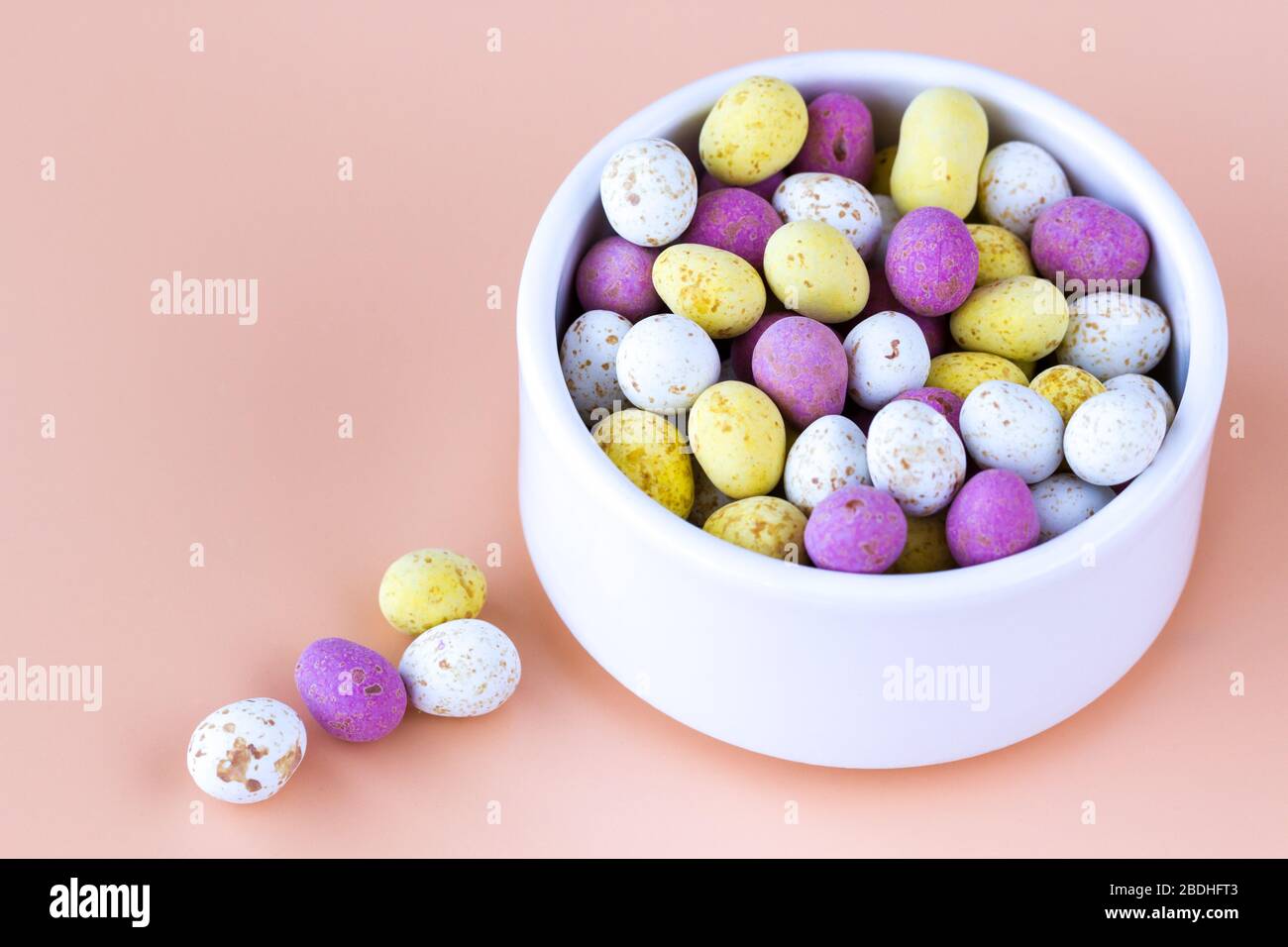 Mini coloured Easter eggs in a white bowl Stock Photo - Alamy