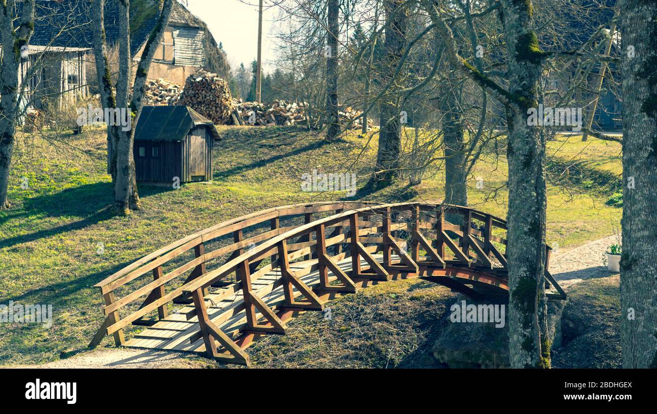 Village house with logs at the bridge Stock Photo - Alamy