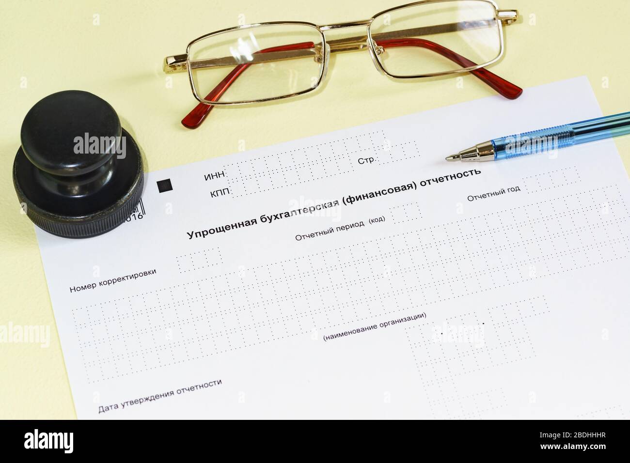 Document design, printing, glasses and pen on the table. Text in ...