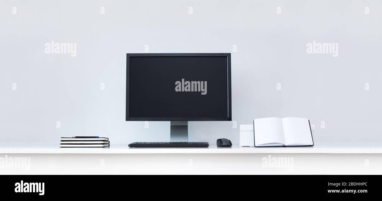 Clean white desk with computer and copy space Stock Photo - Alamy