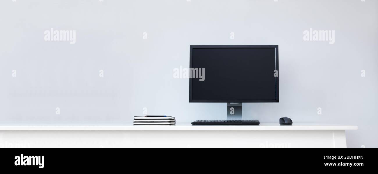 Clean white desk with computer and copy space Stock Photo - Alamy