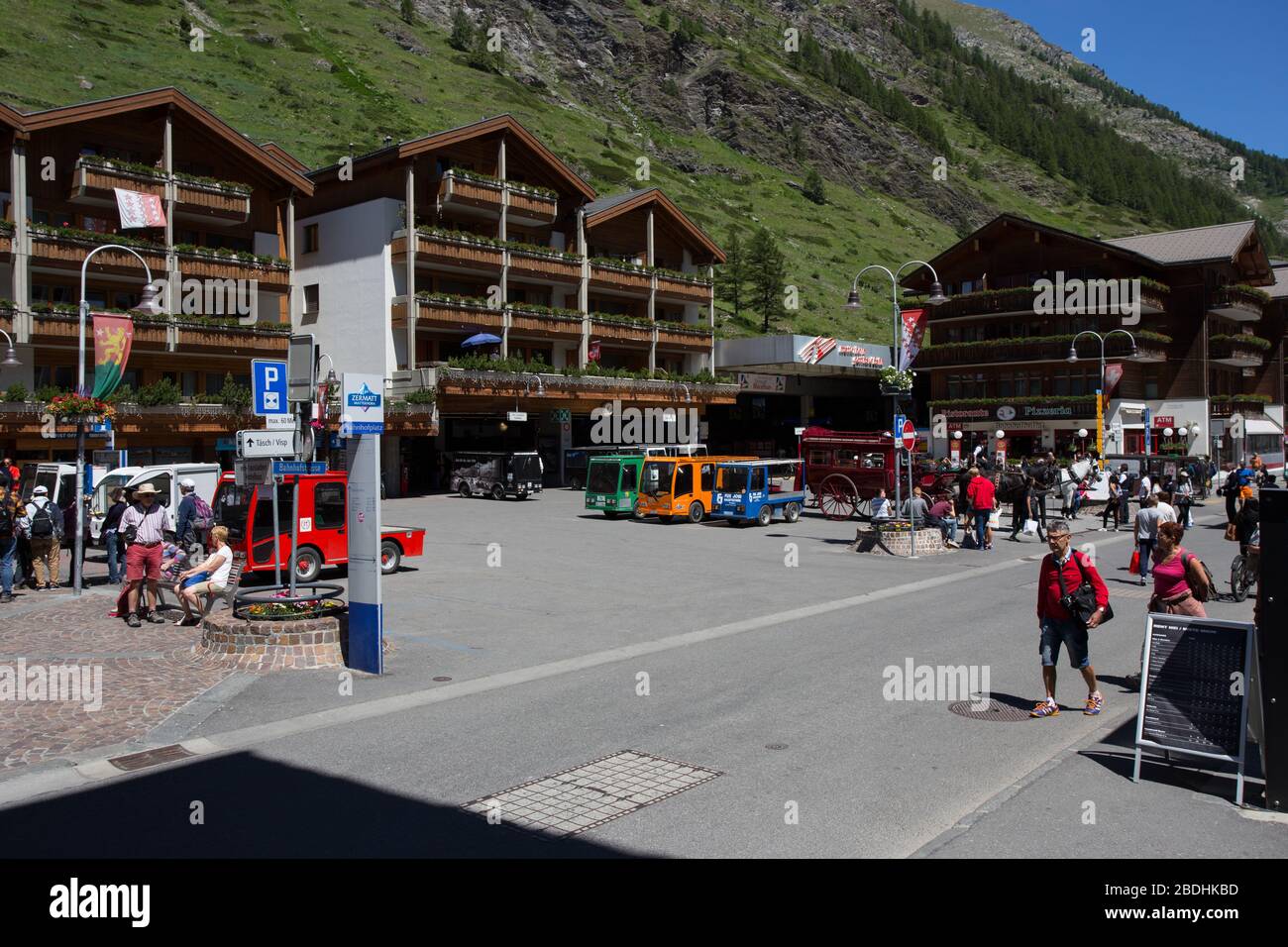 The main square (Bahnhofplatz) outside the rail terminus in Zermatt ...