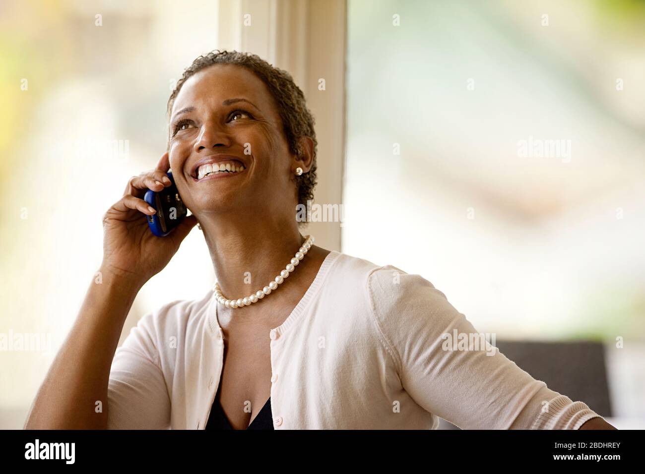 Listening to mobiles hi-res stock photography and images - Alamy
