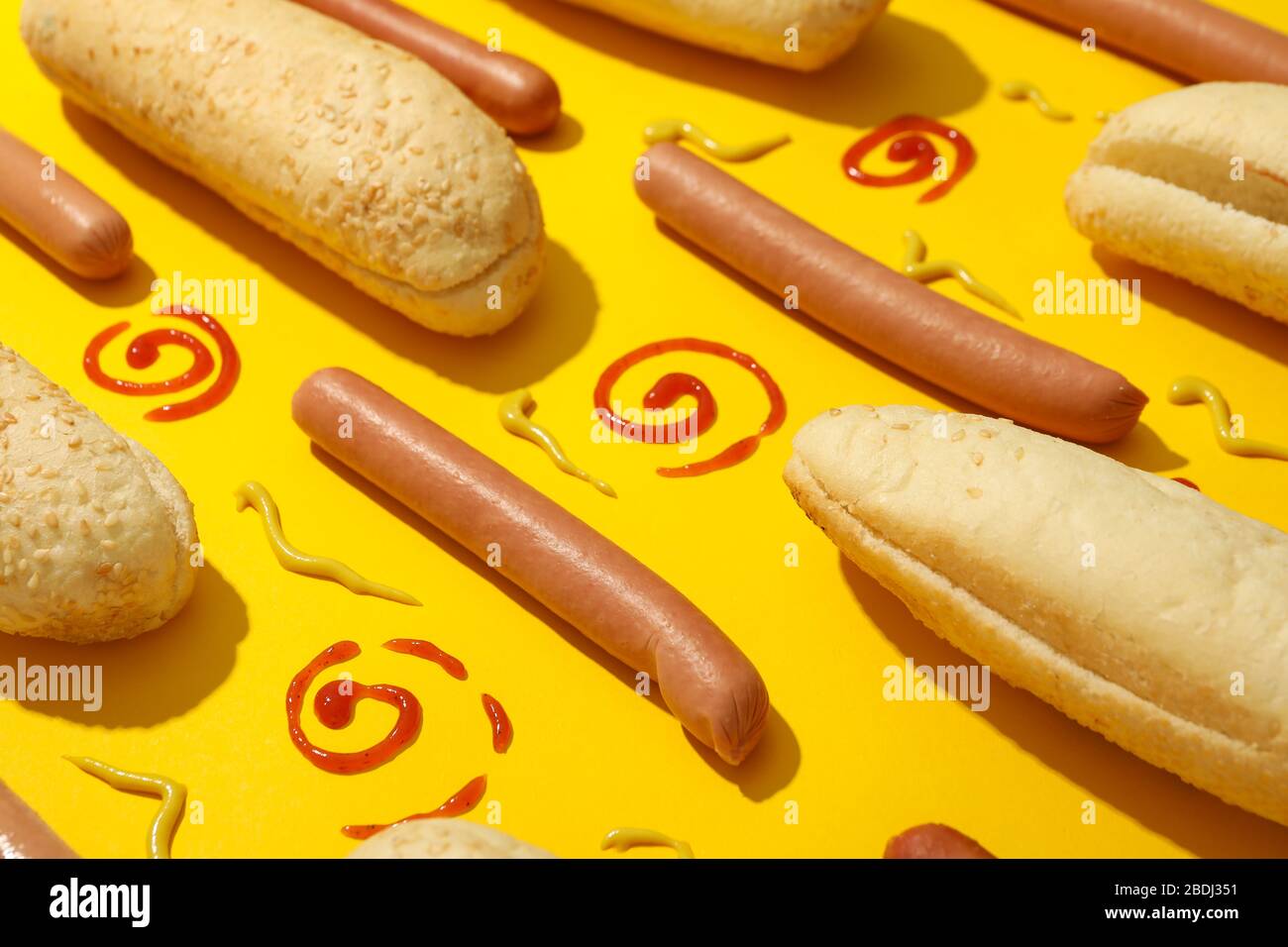 Flat lay with ingredients for hot dog on yellow background Stock Photo ...