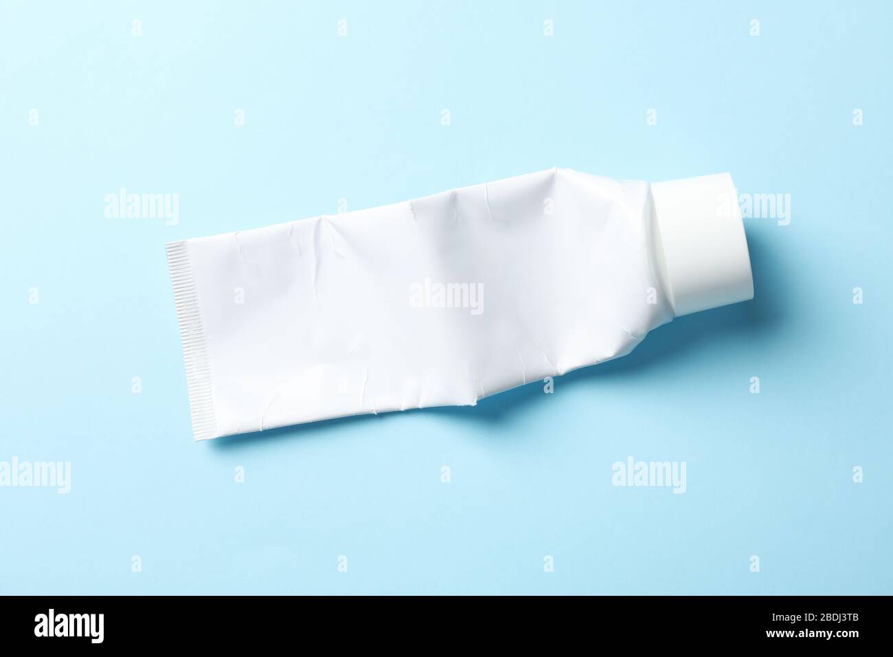 Blank toothpaste tube on blue background, space for text Stock Photo ...