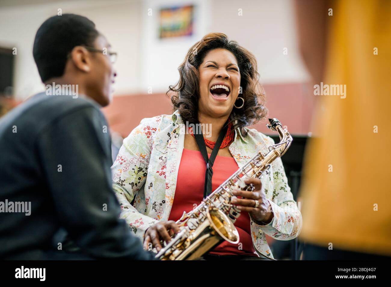 Music teacher and high school student having fun during a lesson Stock ...