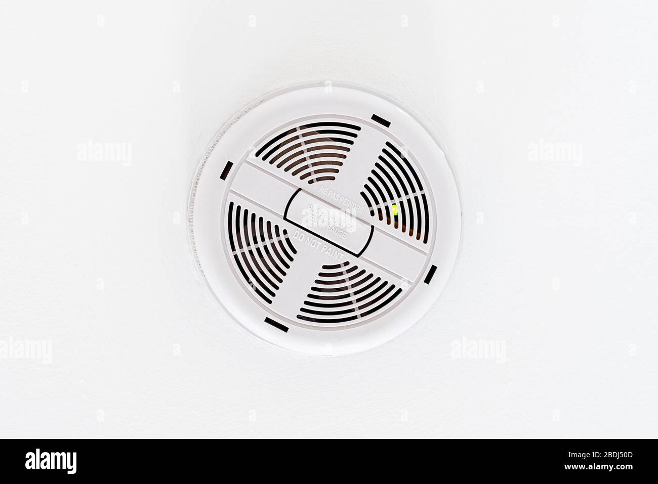 Ceiling mounted electrical smoke detector Stock Photo - Alamy