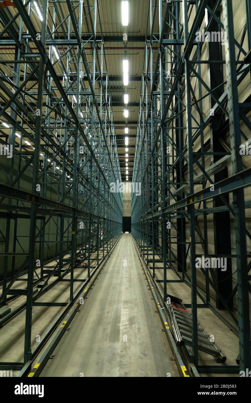 A perspective view of an old warehouse rack in green Stock Photo - Alamy
