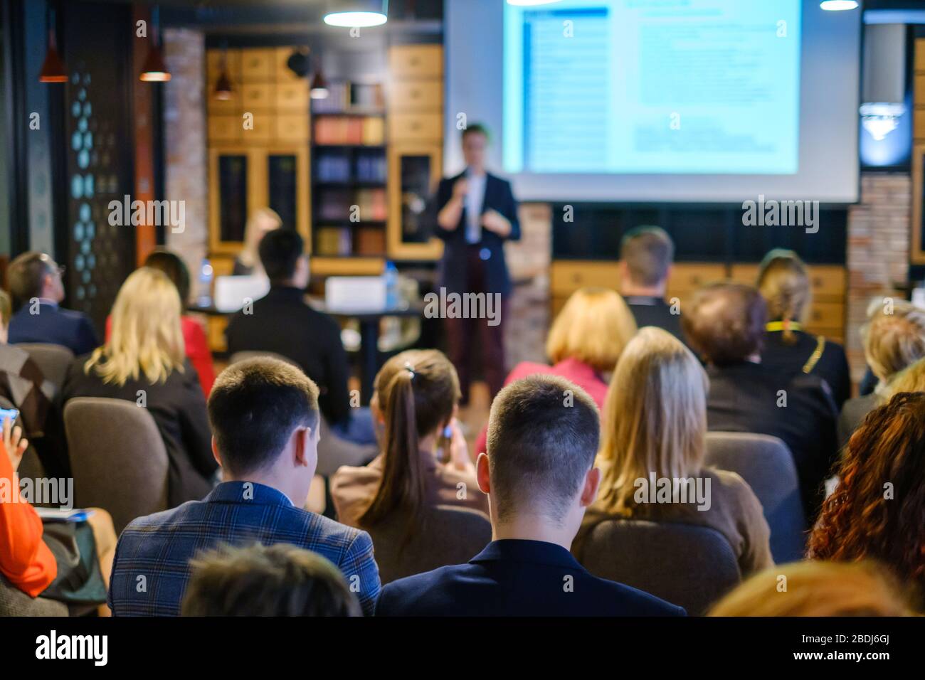 Audience listens lecturer at workshop Stock Photo - Alamy
