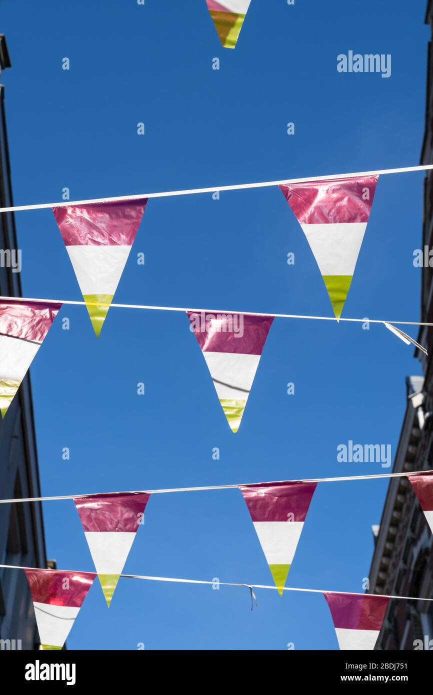 A Dutch triangular flags on a ribbon, in red, white and yellow, of ...