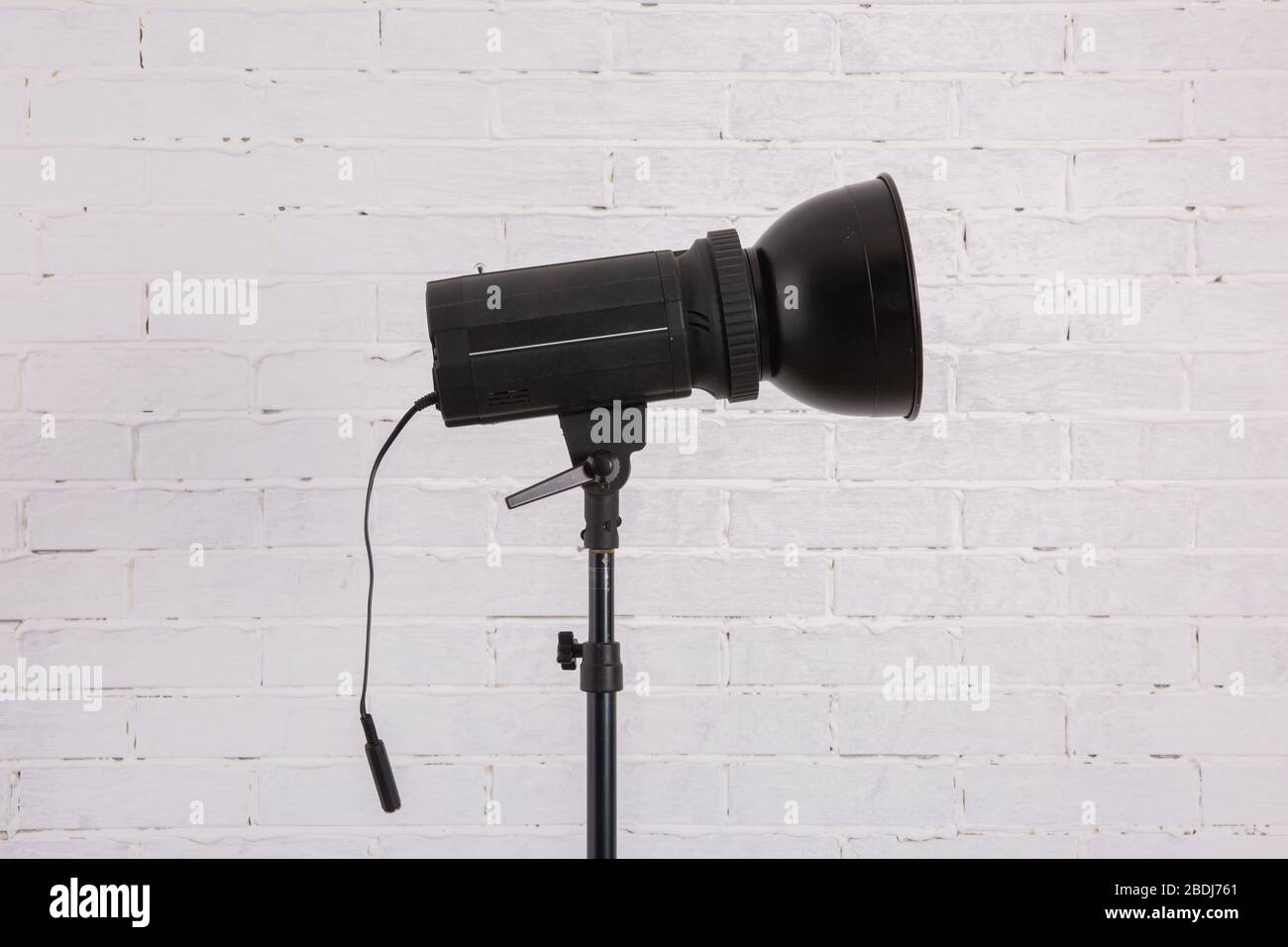 A studio flash fires a lot of light at a time when shooting Stock Photo ...