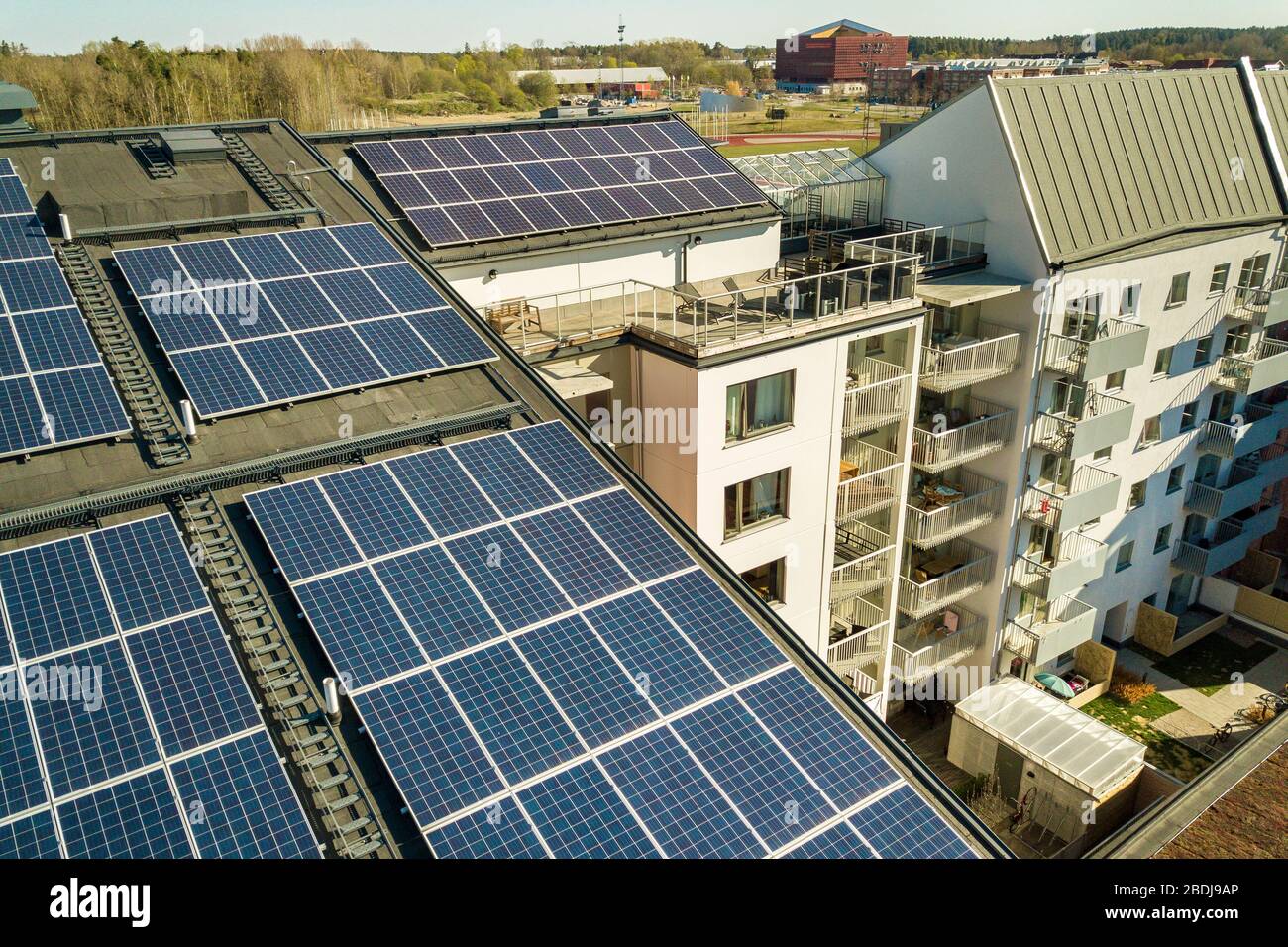 Aerial view of solar photovoltaic panels on a roof top of residential ...