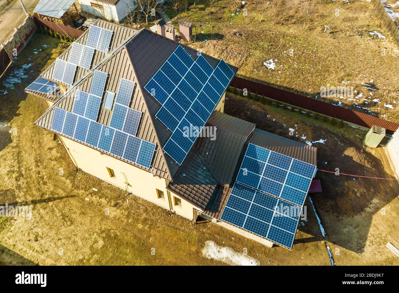 Aerial top view of new modern residential house cottage with blue shiny ...