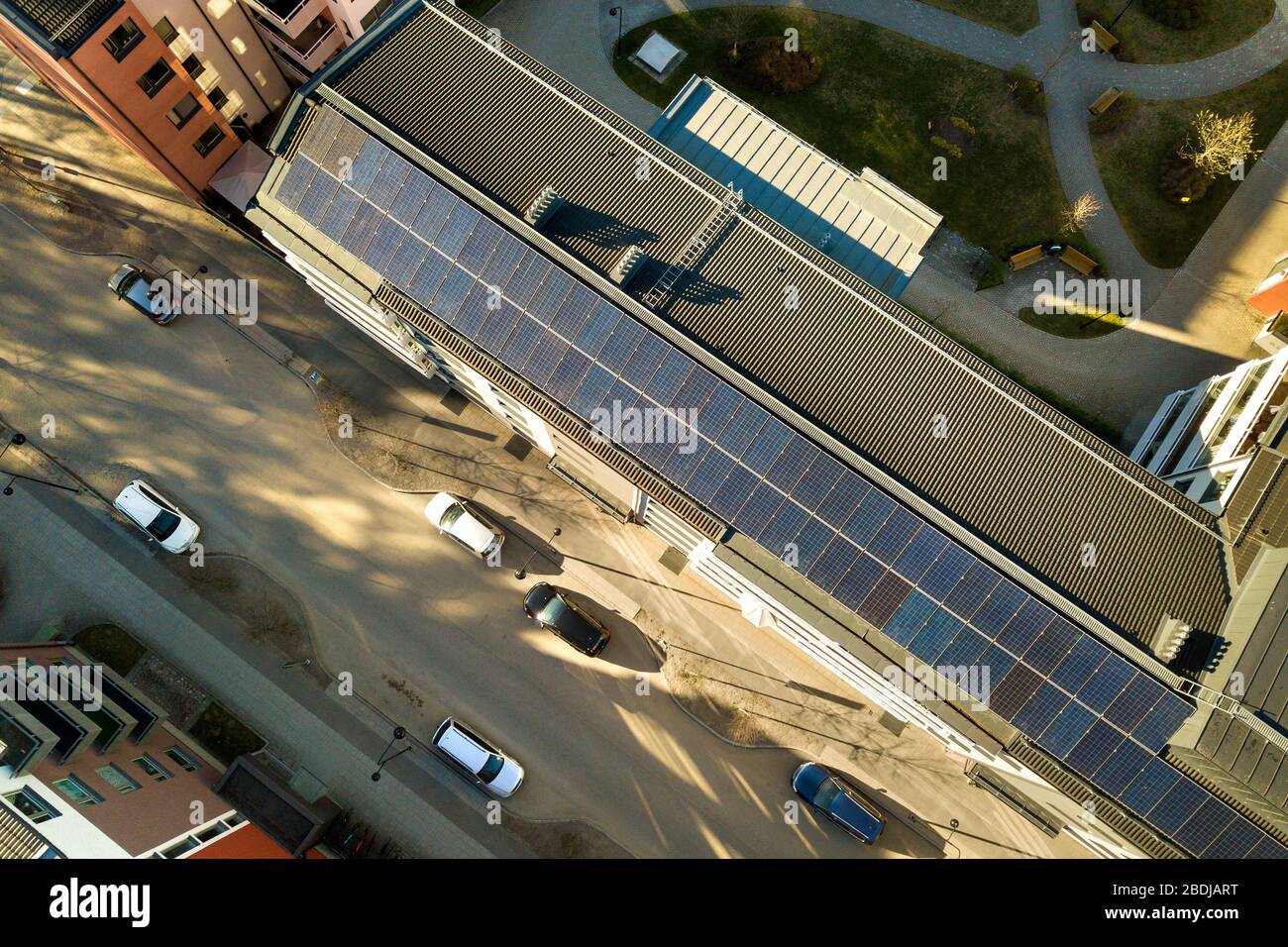 Aerial view of solar photovoltaic panels on a roof top of residential ...
