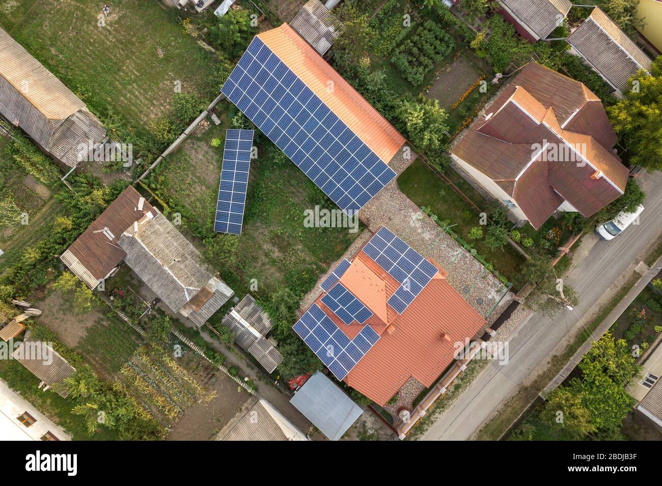 Aerial top view of new modern residential house cottage with blue shiny ...
