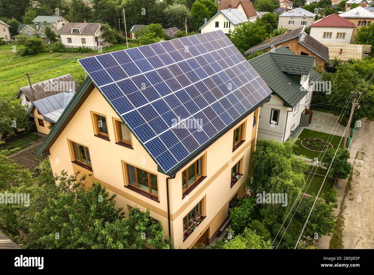 Aerial top view of new modern residential house cottage with blue shiny ...