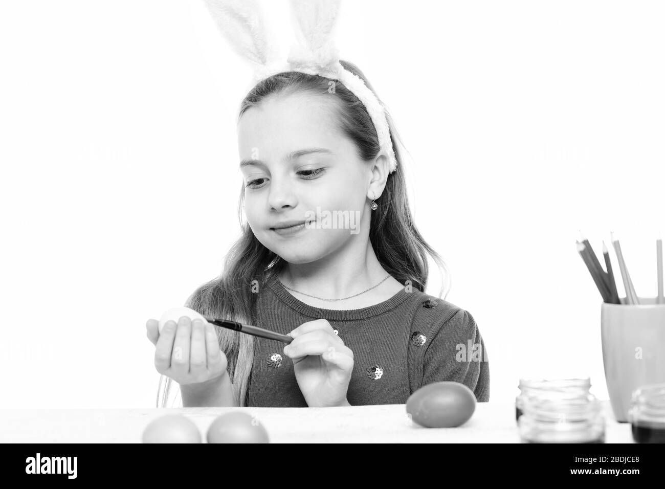 small baby girl or cute child with happy face wearing rabbit pink ears ...