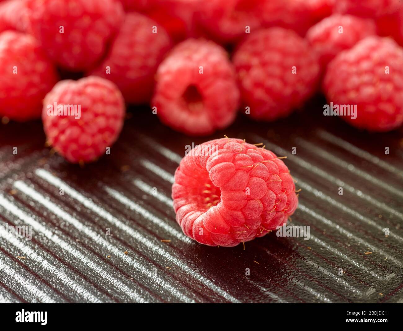 Raspberry fruit single and group food portrait on plain background ...