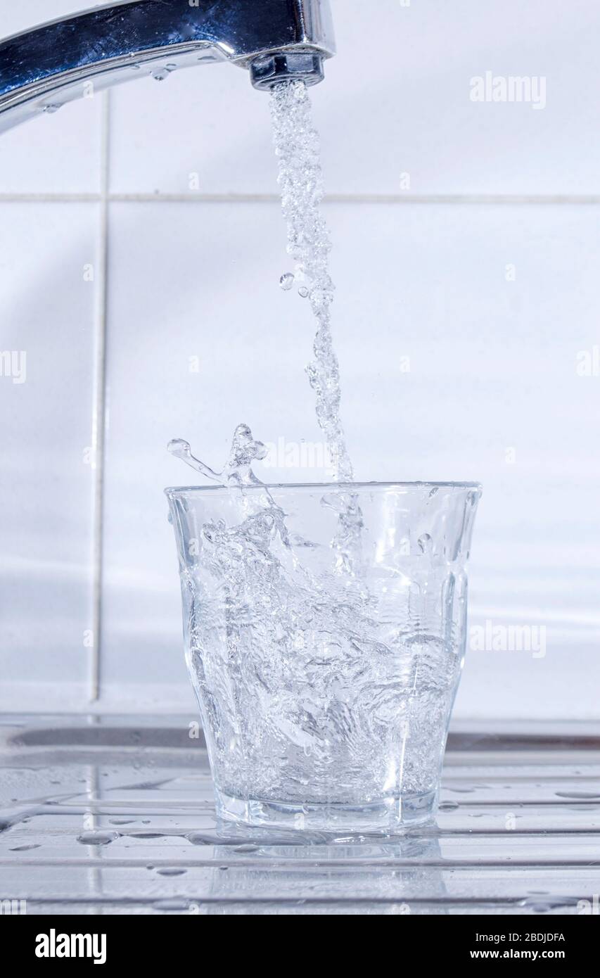 Clear Water Splashing Into A Glass Stock Photo - Alamy