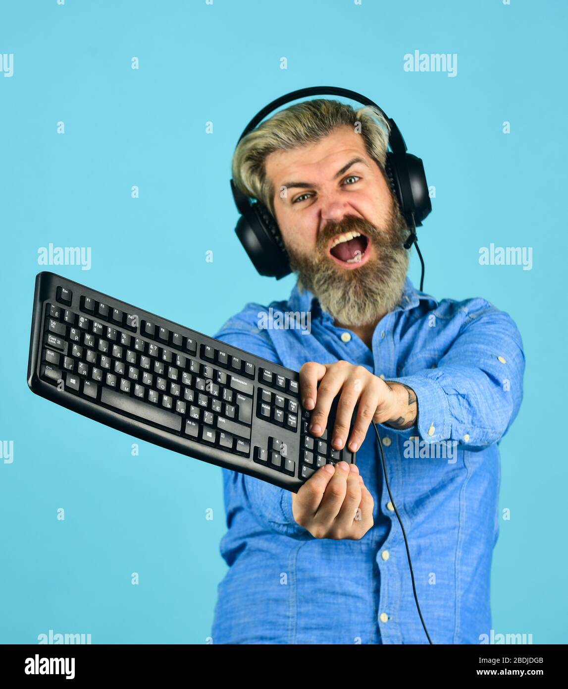 Angry man listening music hi-res stock photography and images - Alamy