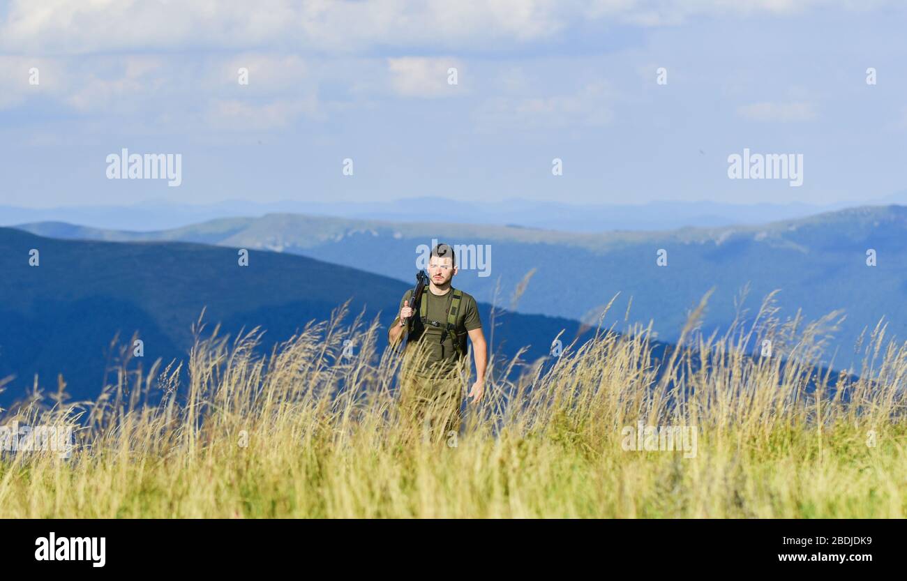 State border guard service. Man with weapon military clothes in field ...