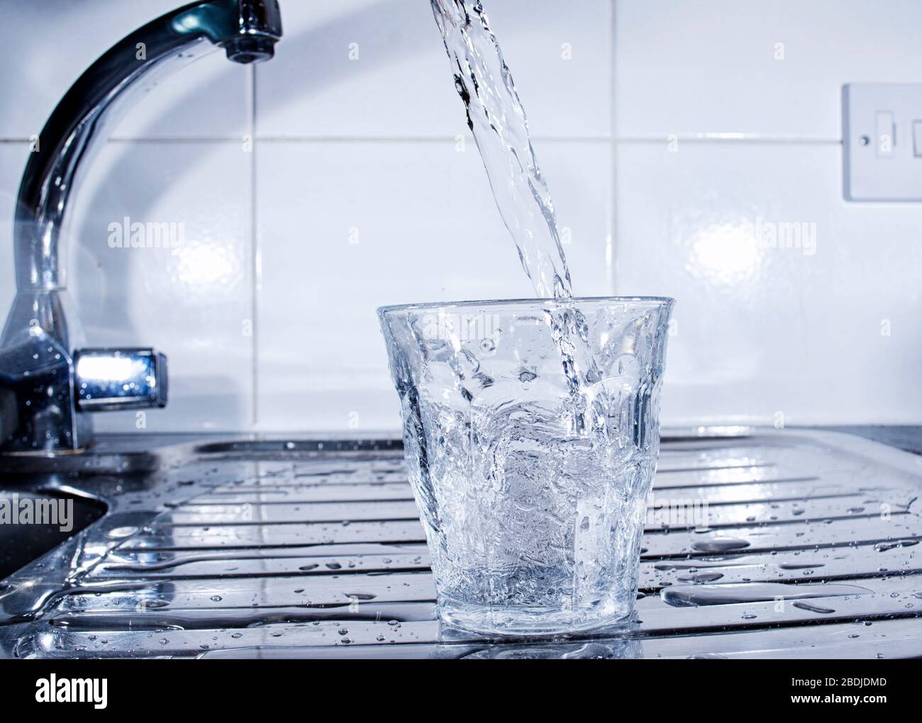 Clear Water Splashing Into A Glass Stock Photo - Alamy