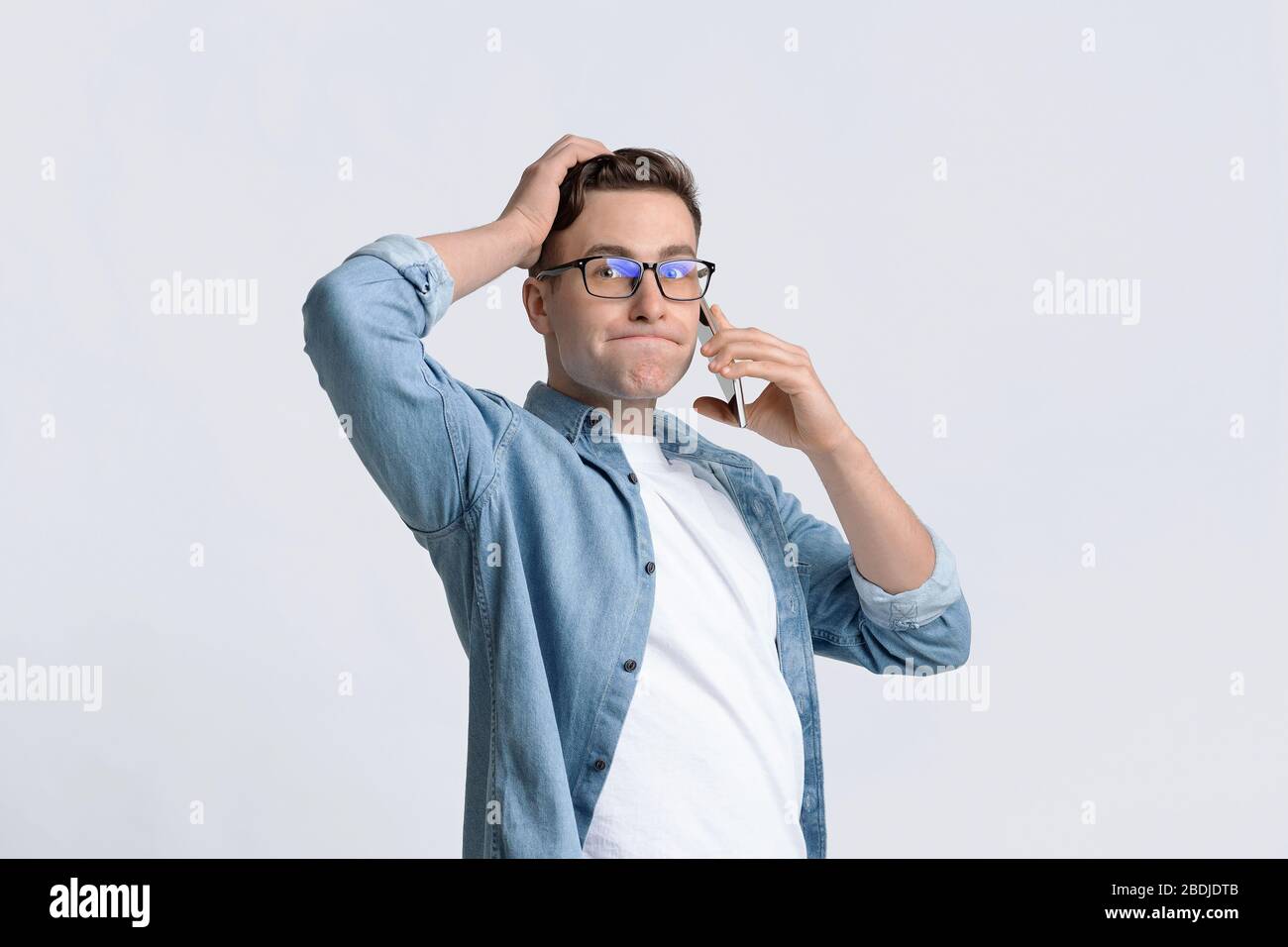 Frustrated guy tightly pressed his lips, copy space Stock Photo - Alamy