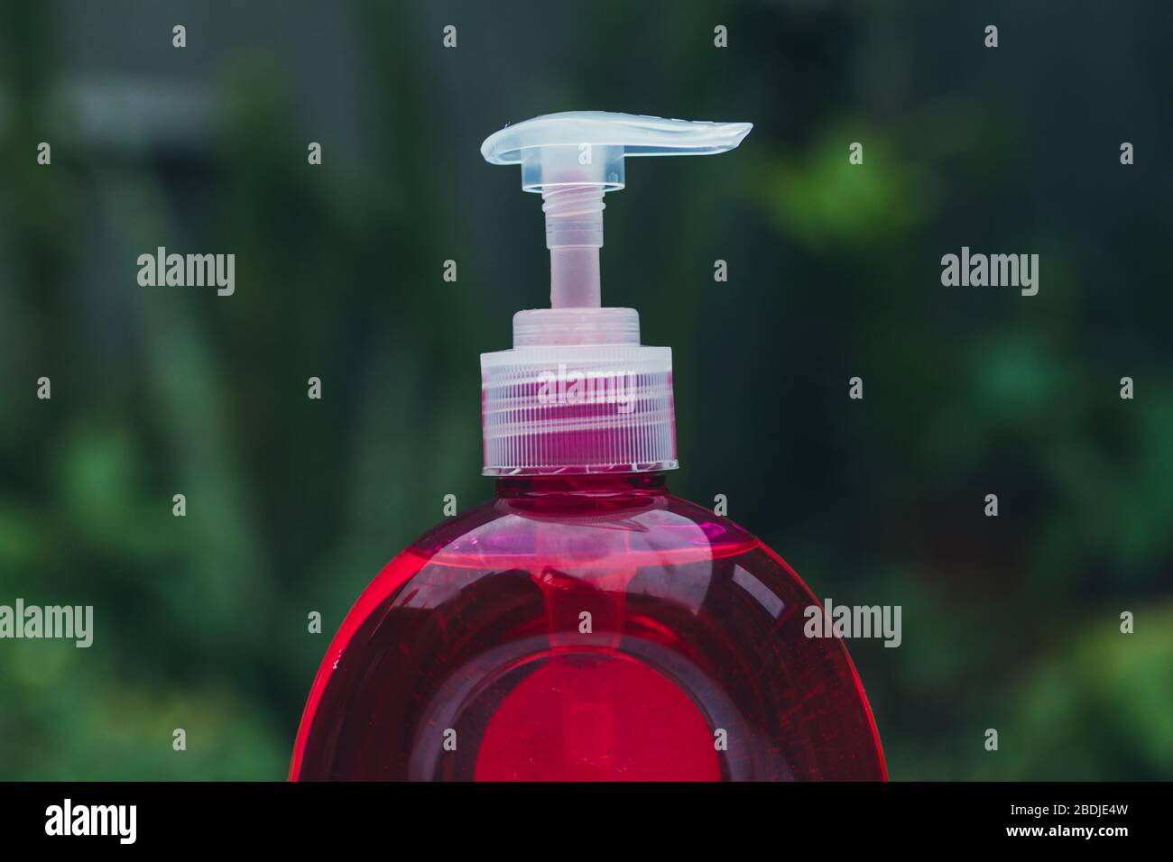 Pump bottle of red soap for cleaning and disinfecting hands Stock Photo ...