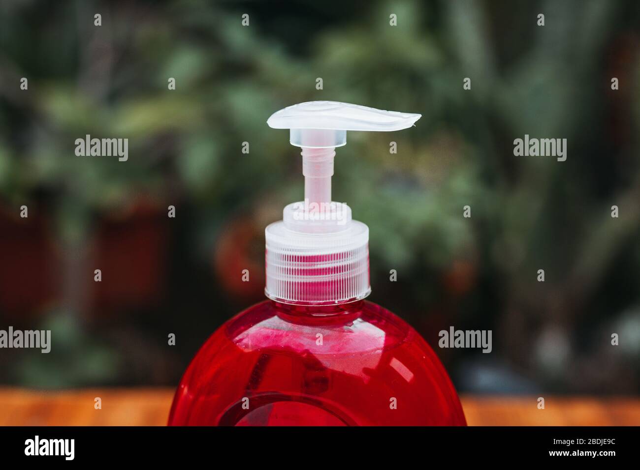Pump bottle of red soap for cleaning and disinfecting hands Stock Photo ...