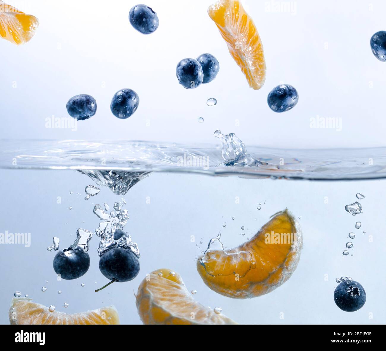 Fruit Splashing into Water Stock Photo - Alamy