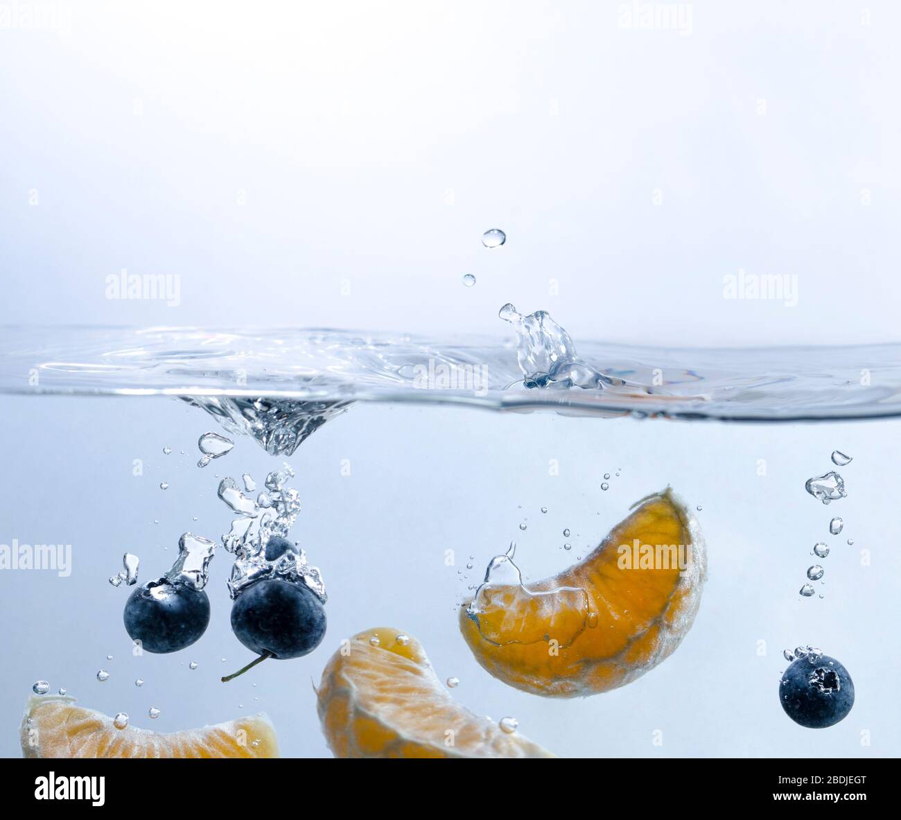 Fruit Splashing into Water Stock Photo - Alamy