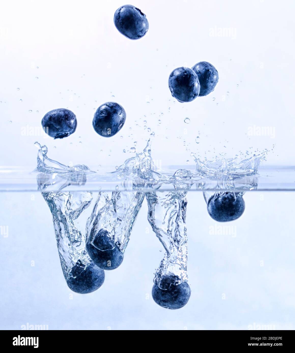 Fruit Splashing into Water Stock Photo - Alamy