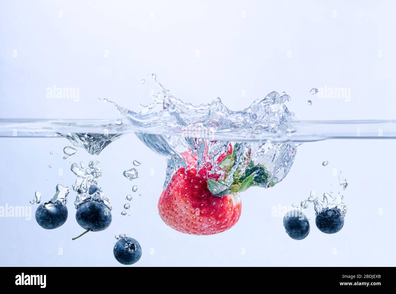 Fruit Splashing into Water Stock Photo - Alamy