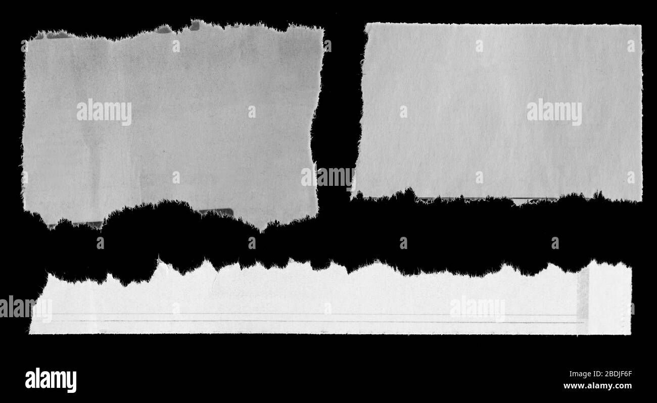 Three pieces of torn newspaper on black background Stock Photo - Alamy