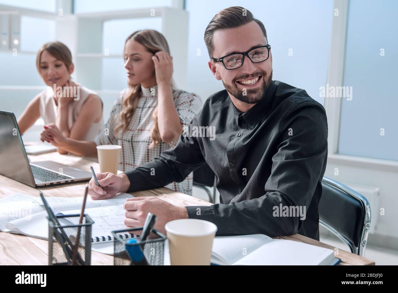 handsome businessman checking business documents . business concept ...
