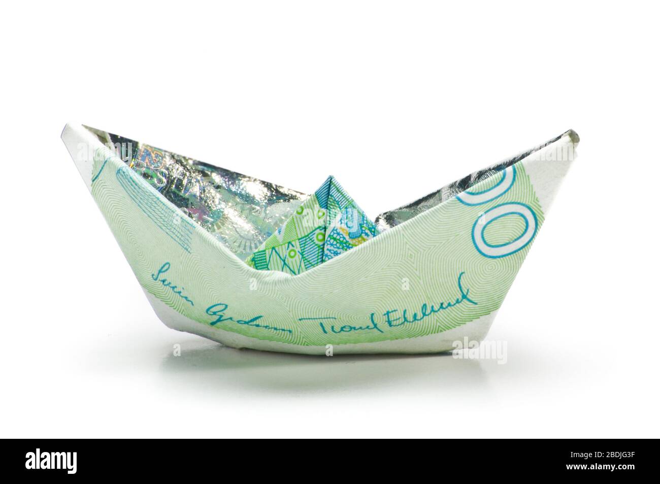 Money origami ship isolated on the white background Stock Photo - Alamy