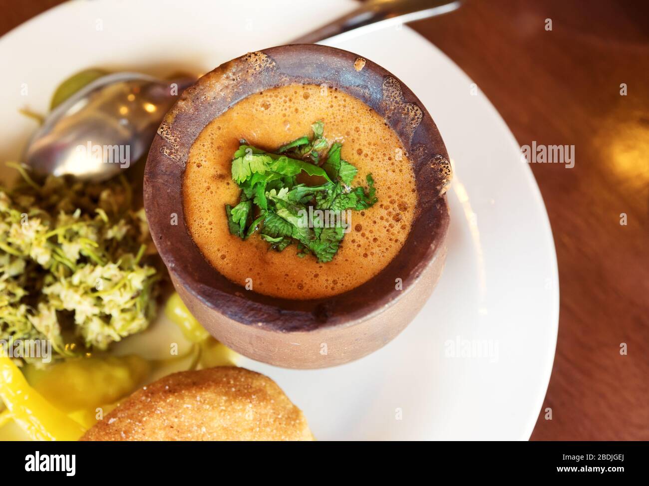 Lunch at Georgian cafe. Lobio of beans in clay pot, mchadi (cornbread ...