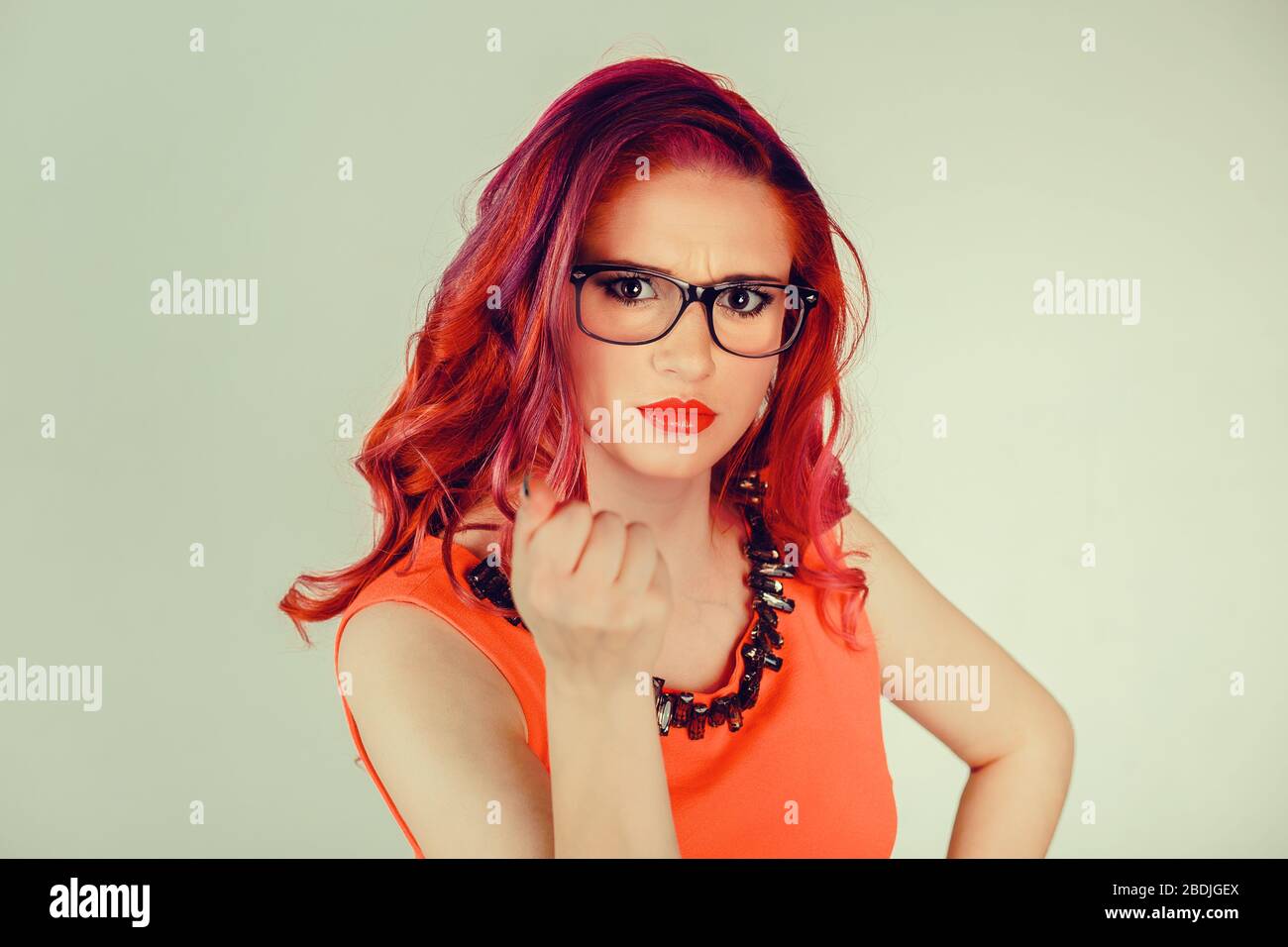 Closeup portrait angry young woman showing fists about to punch hit ...