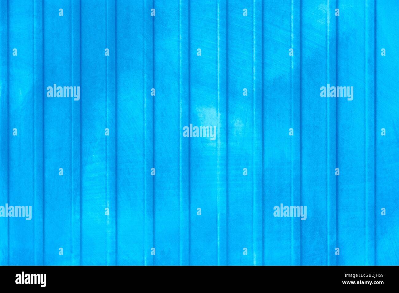 Blue background. Weathered profiled steel sheets on an industrial ...