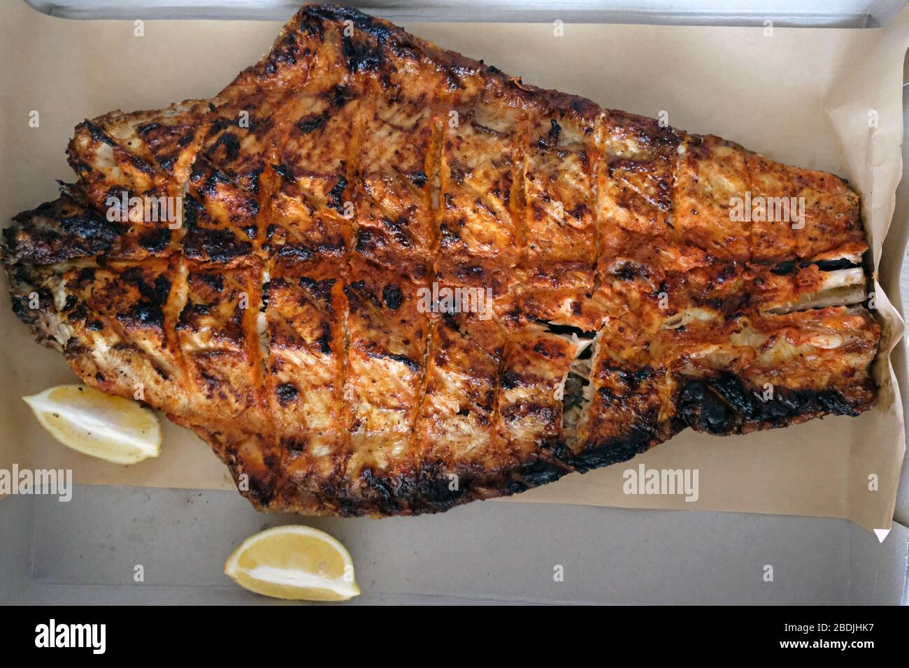sturgeon filet top view. grilled sturgeon fish. Lemon slices and fried ...