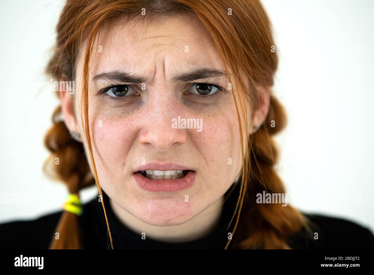 Close up portrait of angry redhead teenage girl Stock Photo - Alamy