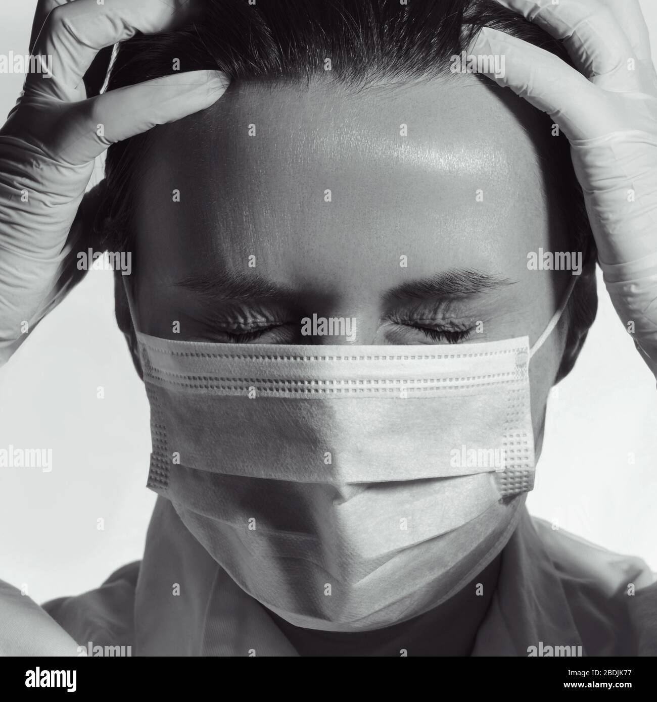 Black and white portrait of a Woman wearing mask and closing eyes ...