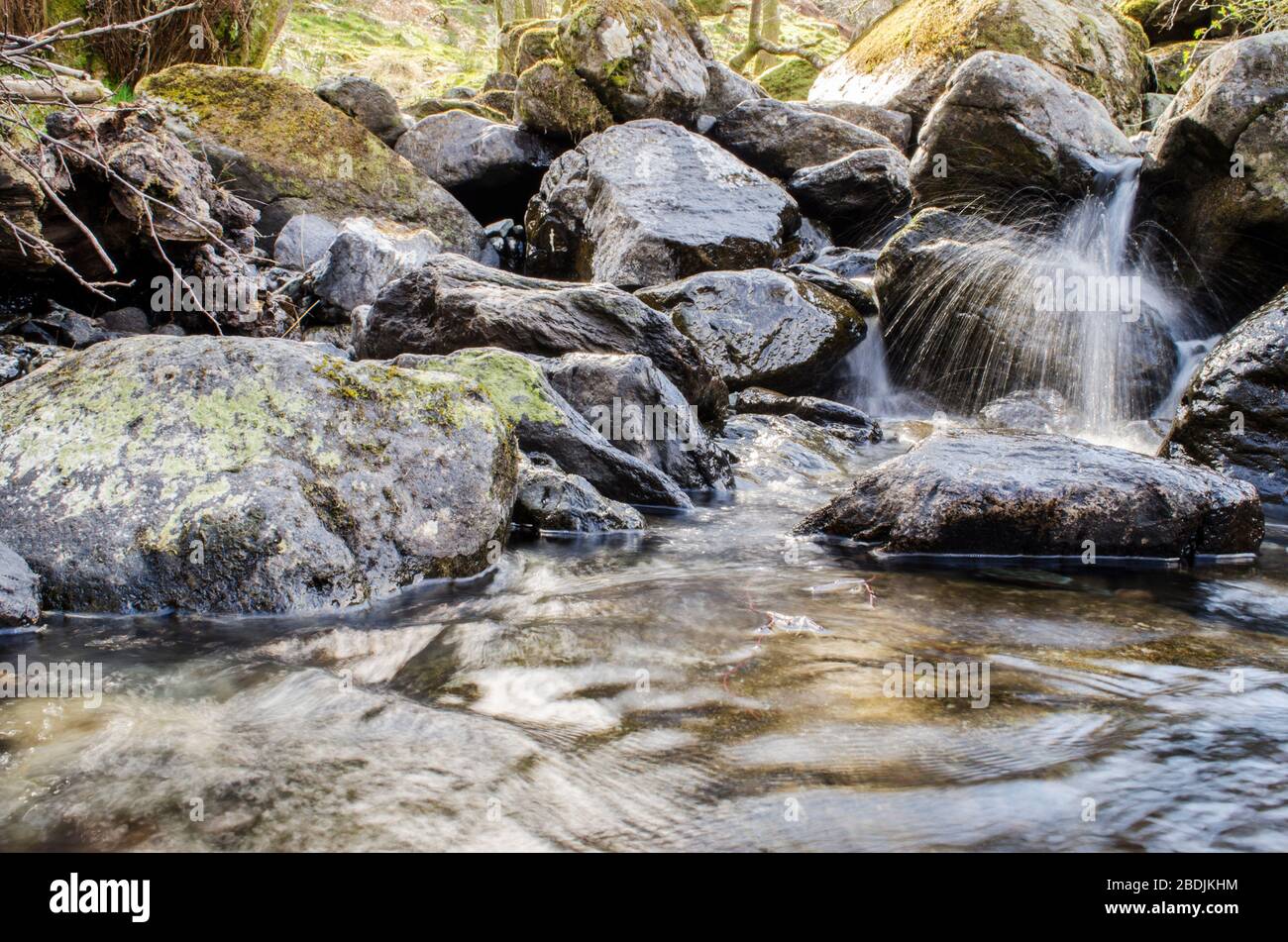 Stream water flowing over rocks hi-res stock photography and images - Alamy