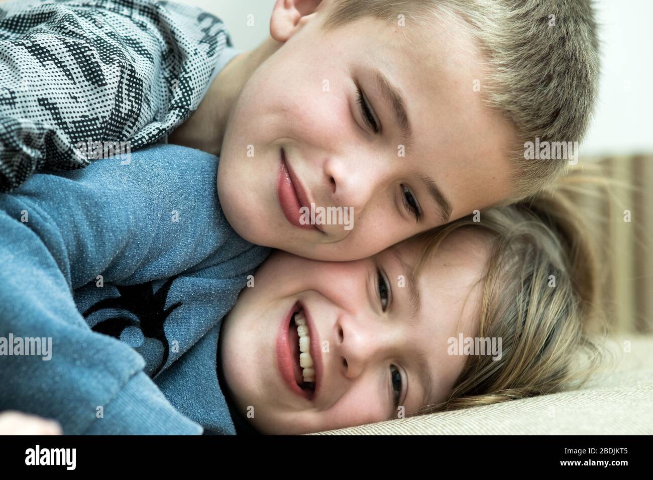 Two children boy and girl fooling around having fun together. Happy ...