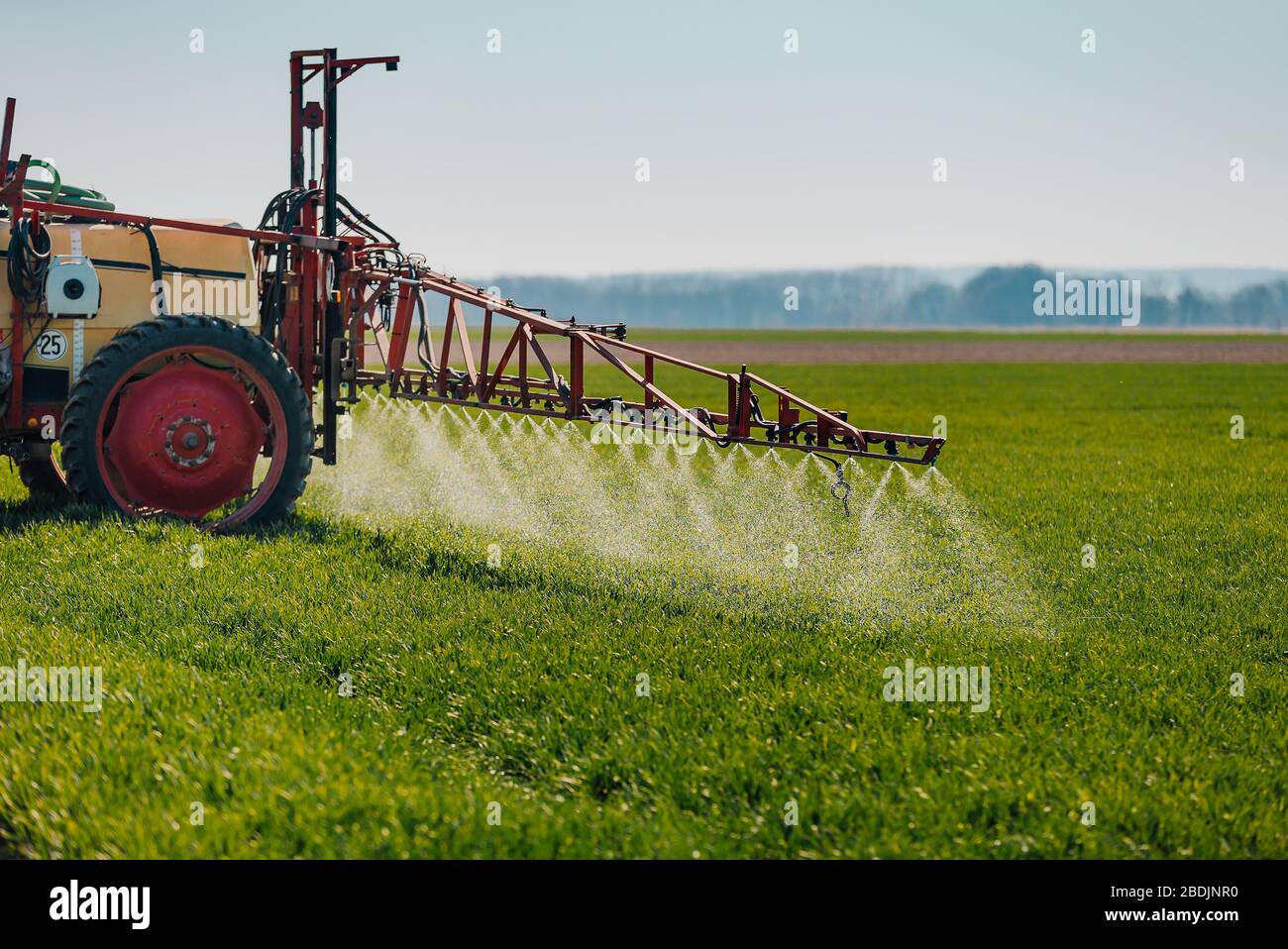 Tractor spray field herbicide insecticide hi-res stock photography and ...